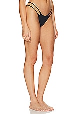 Indah Jovi Skimpy Solid Smocked String Bikini Bottom in Black | REVOLVE