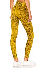 Nike Python Legging in Speed Yellow | REVOLVE