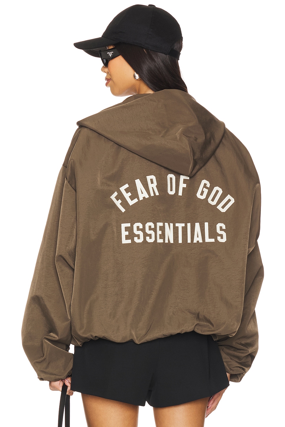 Fear of God ESSENTIALS Hooded Bomber Jacket in Brown | REVOLVE